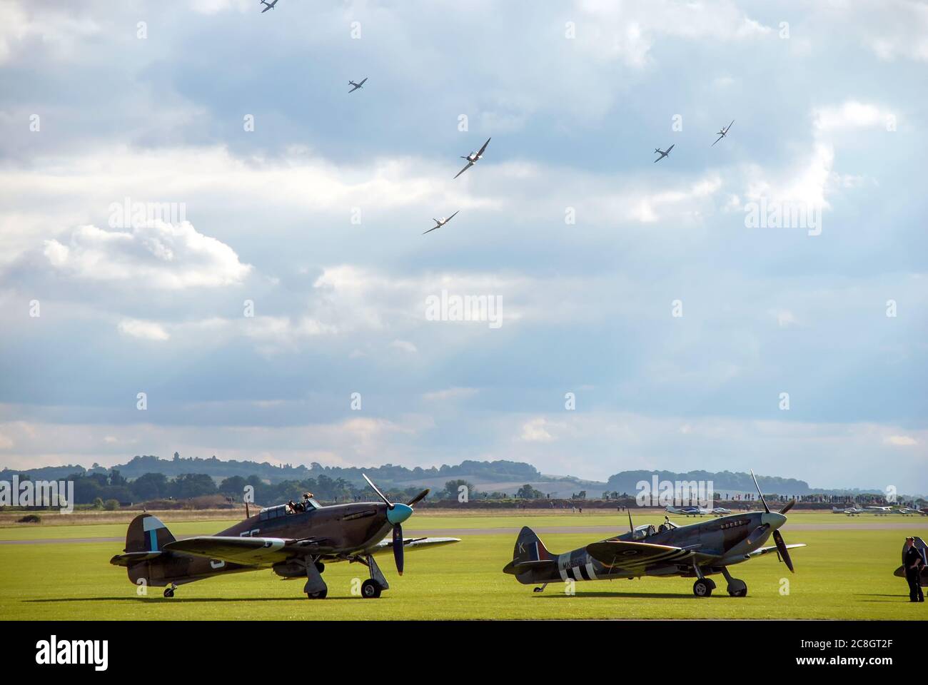 RAF fighter aircraft from the Battle of Britain era park at an airfield ...