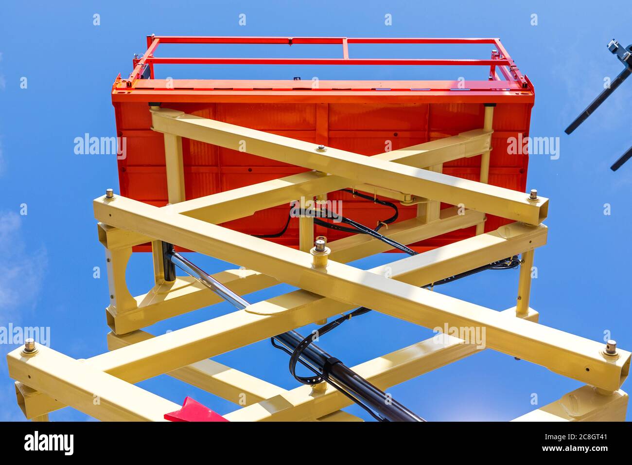 Tall Scissor Lift Platform Machine at Construction Site Stock Photo - Alamy