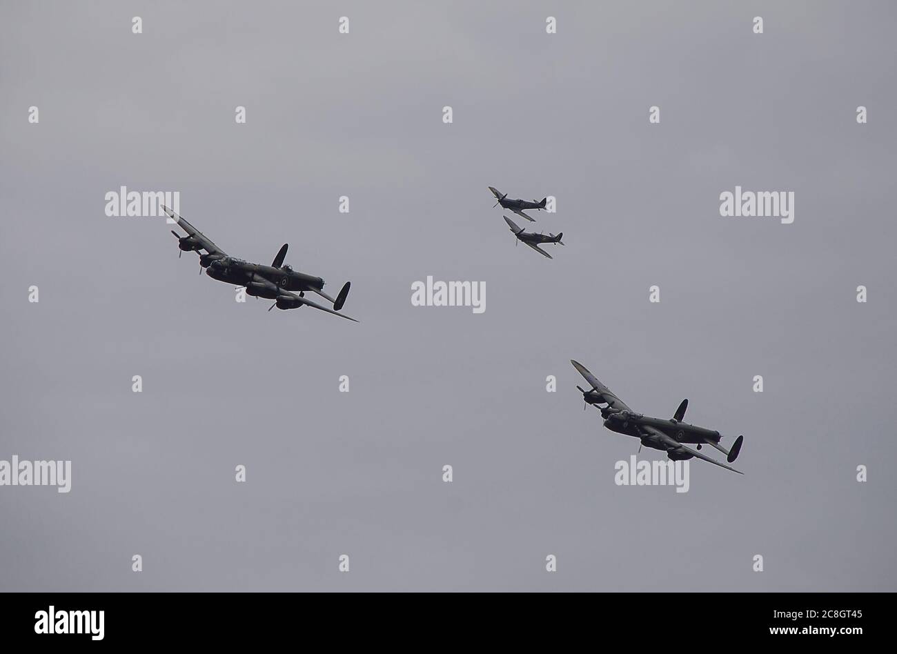 The RAF's iconic Avro Lancaster heavy bomber escorted by Supermaine ...