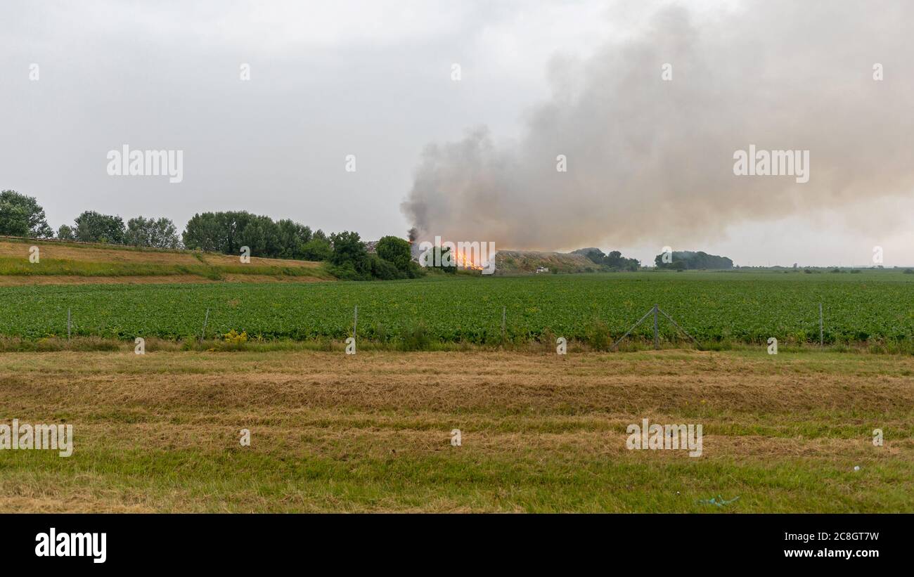 Landfill Garbage Fire Inferno With Heavy Smoke Stock Photo - Alamy