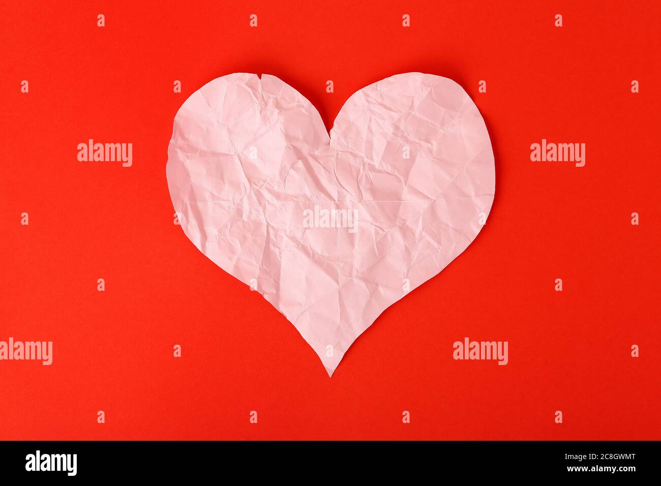 Pink crumpled paper heart hi-res stock photography and images - Alamy
