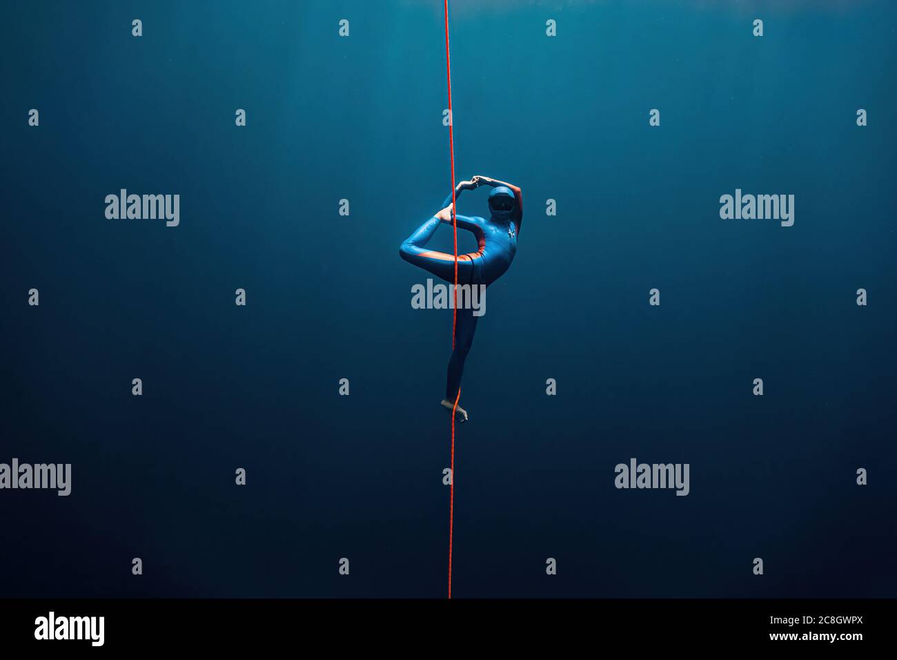 A free diver and yogi doing yoga pose underwater Stock Photo - Alamy