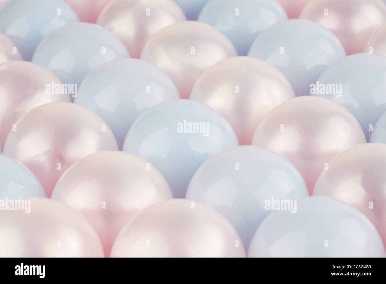 Blue and pink plastic balls as a background Stock Photo - Alamy