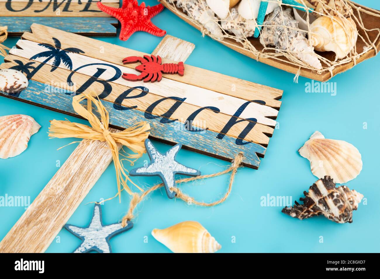 Wooden signs welcome beach and shells on blue background Stock Photo ...