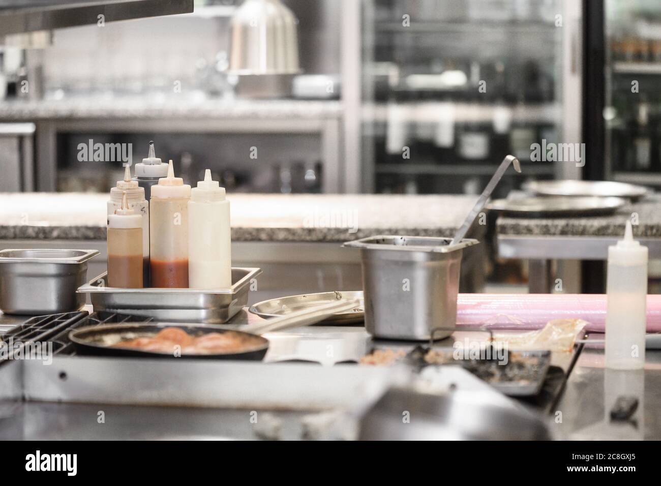 Food being cooked in commercial stainless steel kitchen in restaurant ...