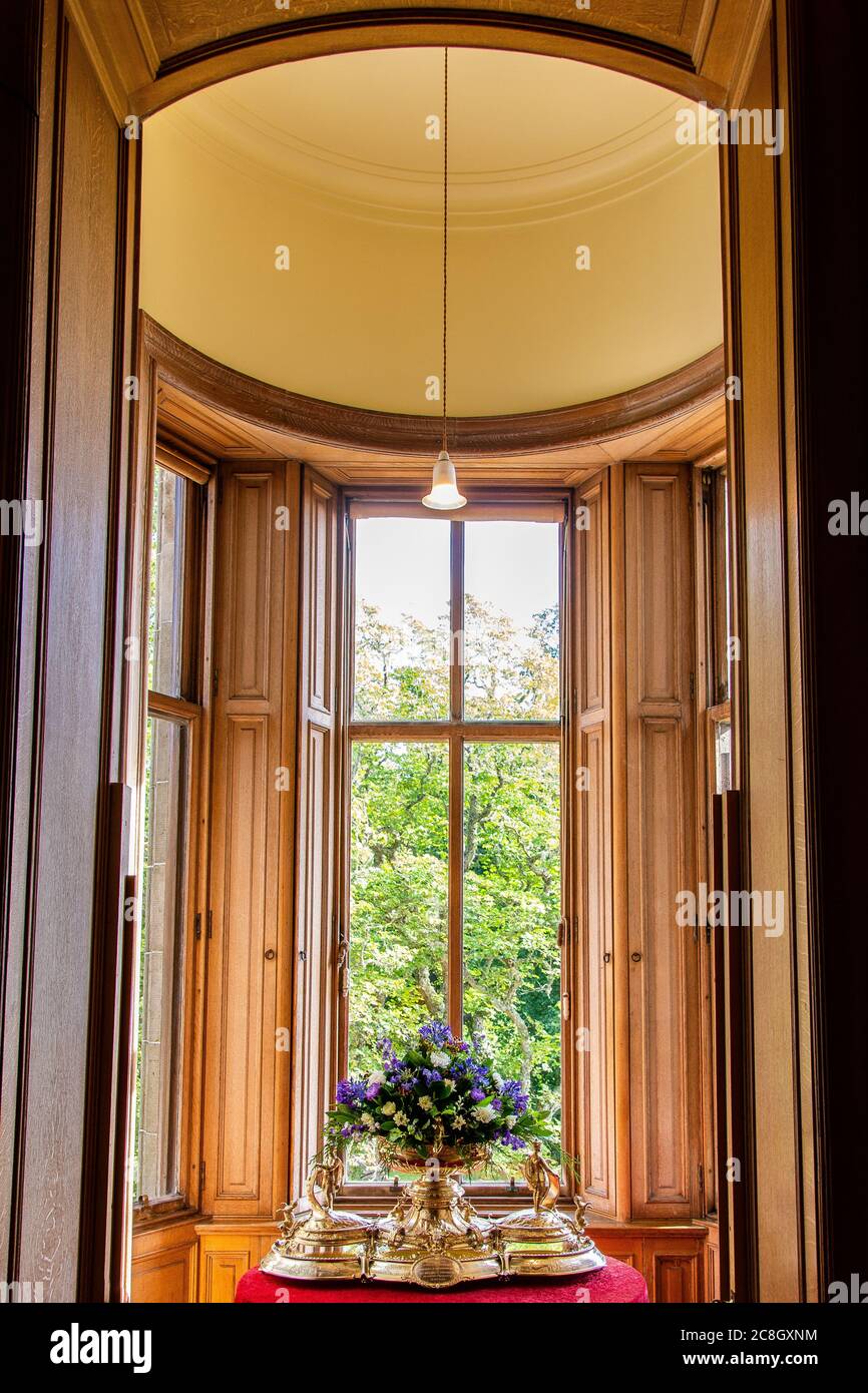 Beautiful vintage lodge with a big window in an old traditional manor ...