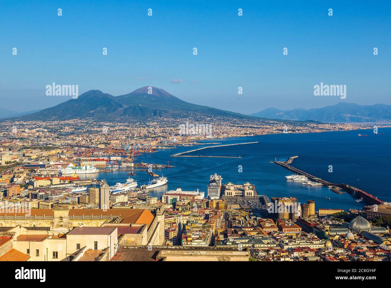 Napoli (Naples) and mount Vesuvius in the background at sunset in a ...