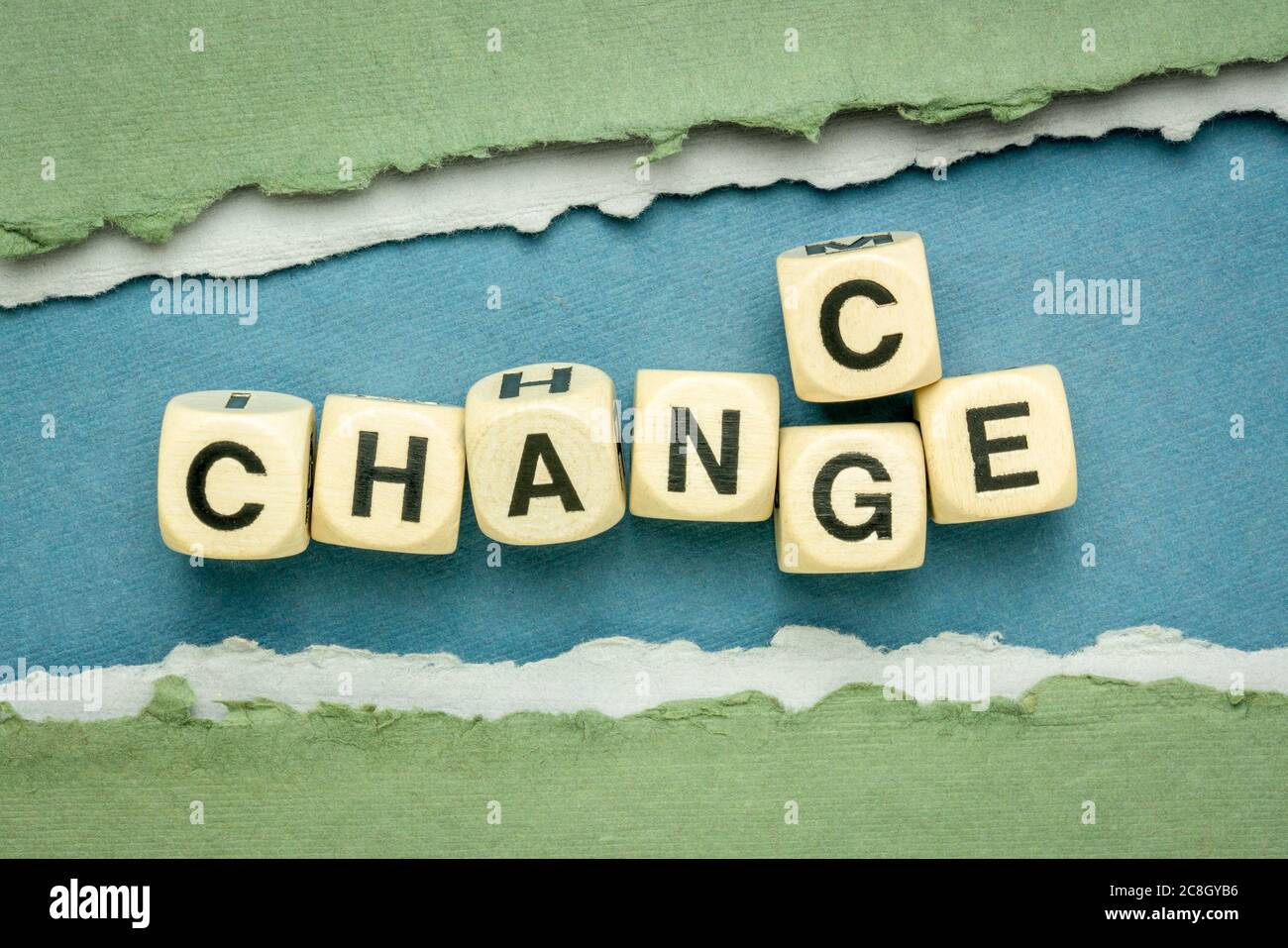 change and chance - word abstract in wooden cubes against handmade ...