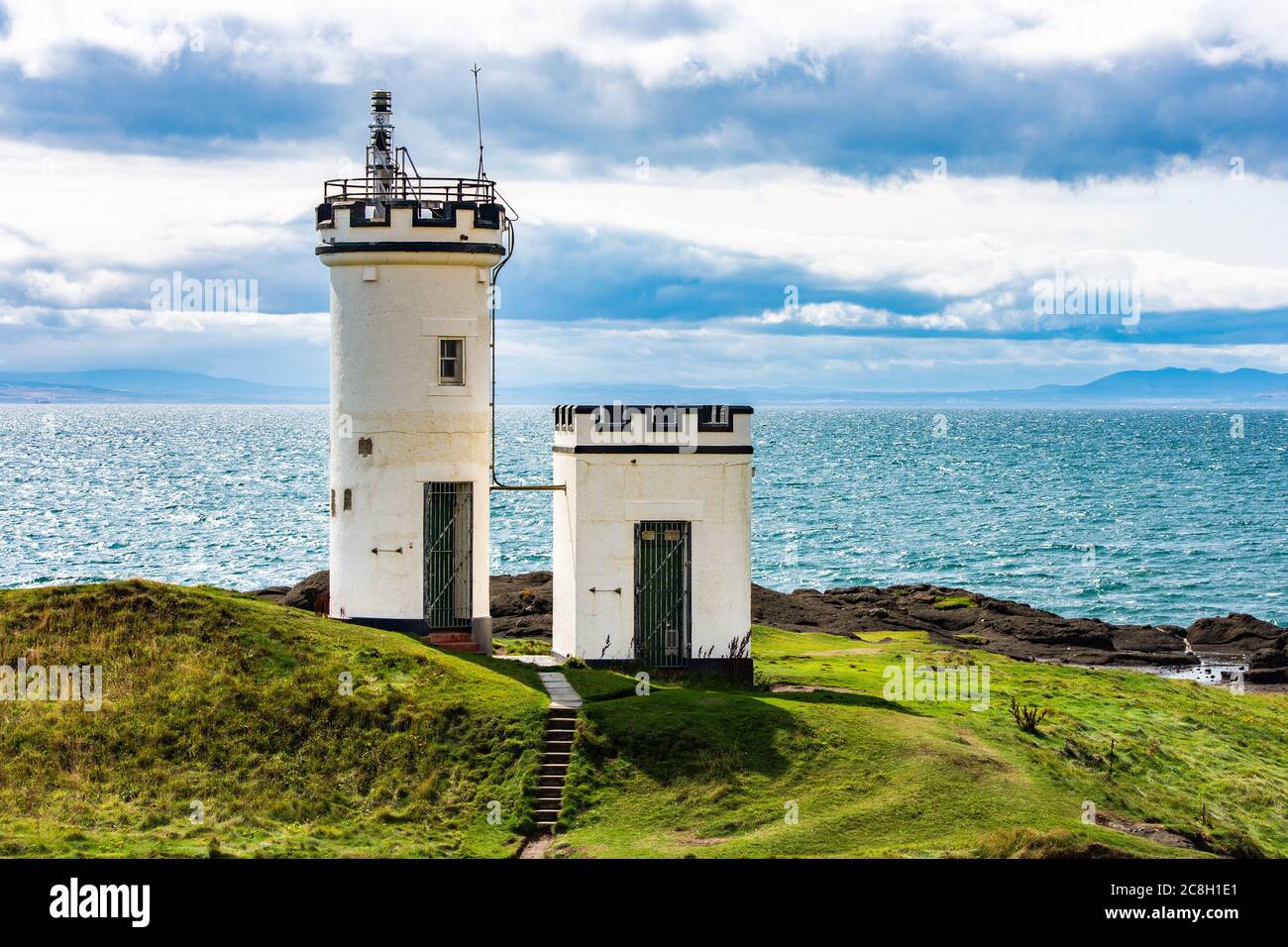 Elie Ness lighthouse and the "Lady's Tower" on a beautiful Scottish ...