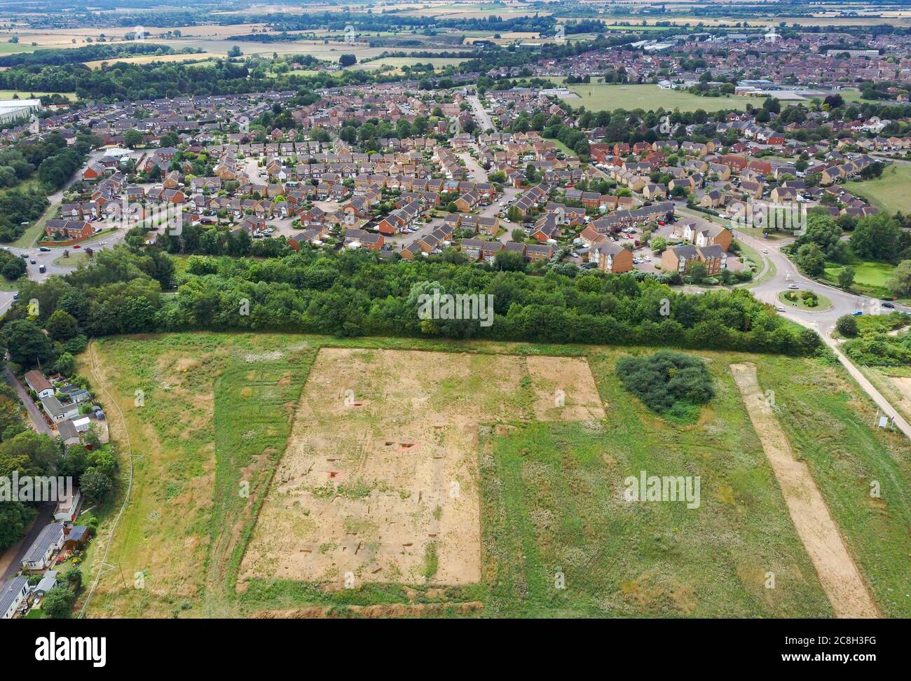 Field stripped for an archaeological excavation with encroaching modern ...