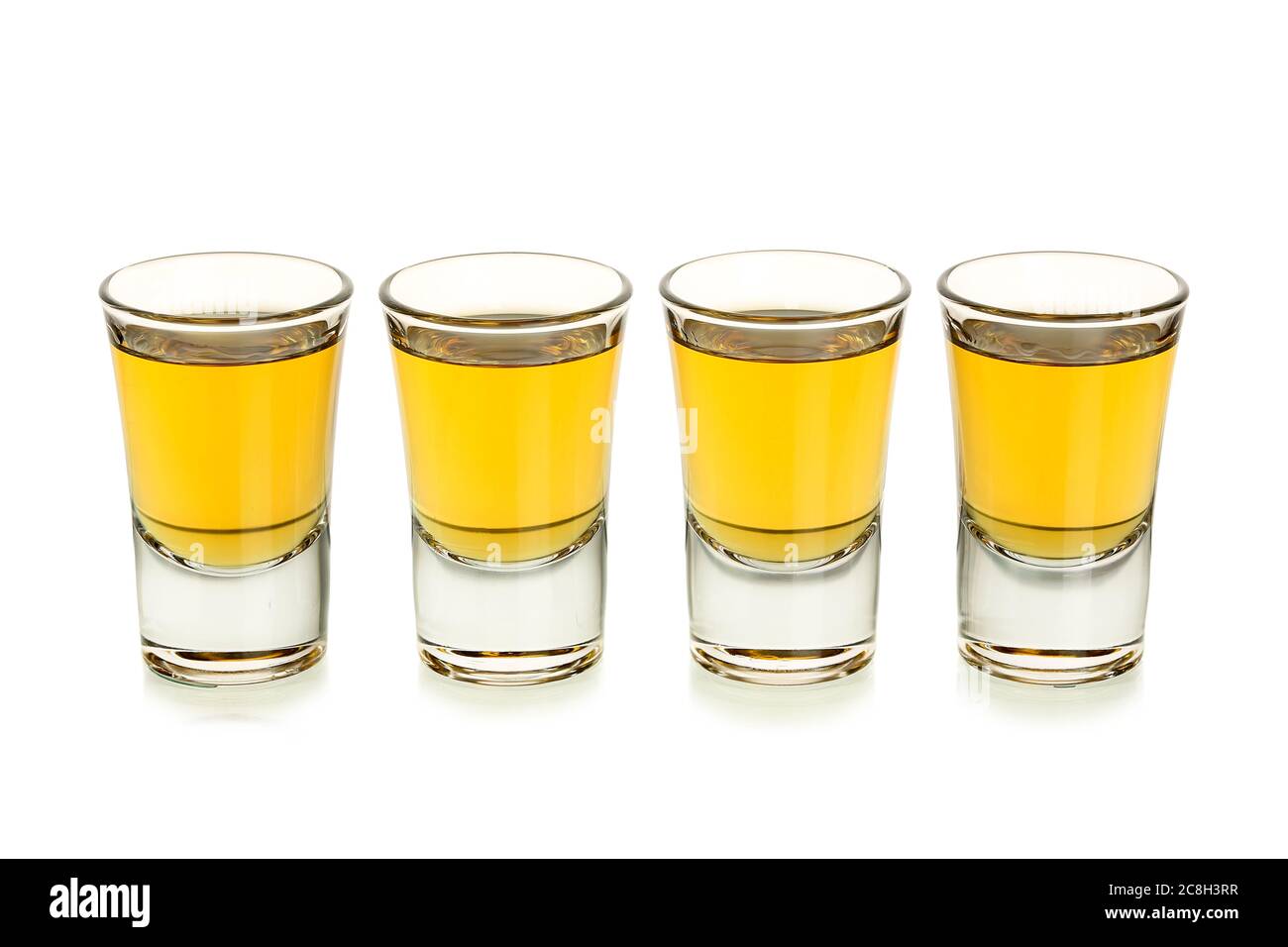 four whiskey shots isolated on white Stock Photo - Alamy