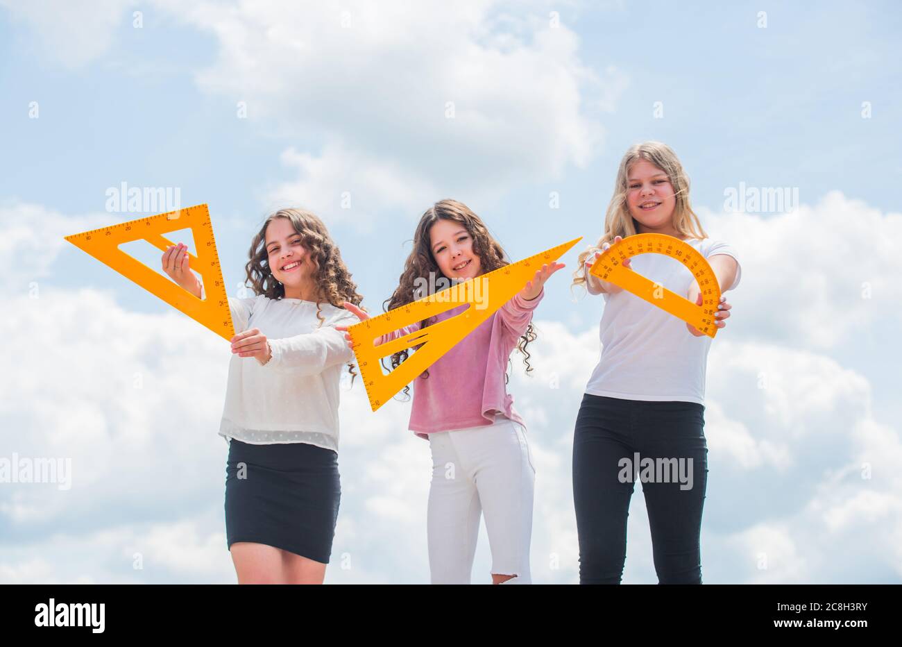 exact sciences. three girls with protractor and triangle ruler. back to ...