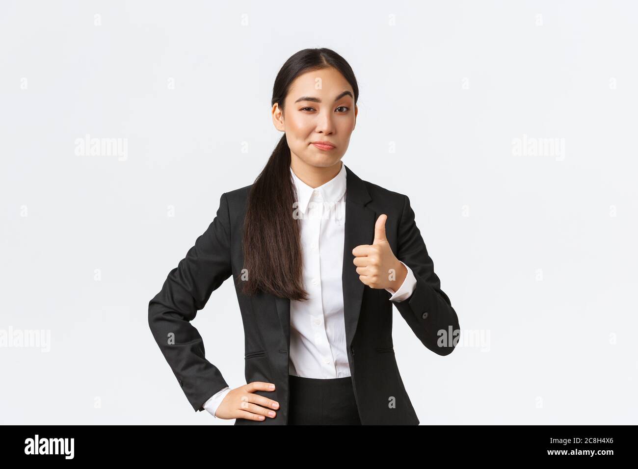 Pleased female entrepreneur, lady boss in black suit satisfied with ...