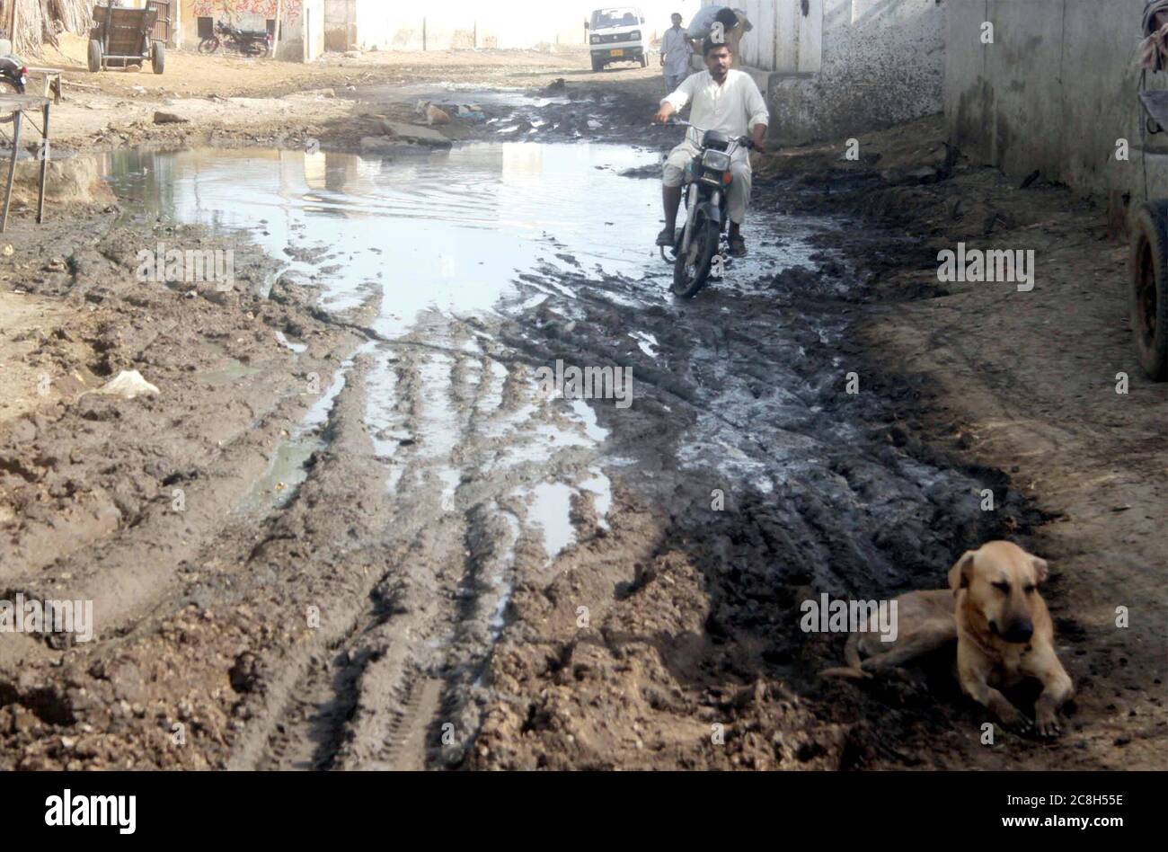 Hectic street full of garbage and sewerage water causing unhygienic ...