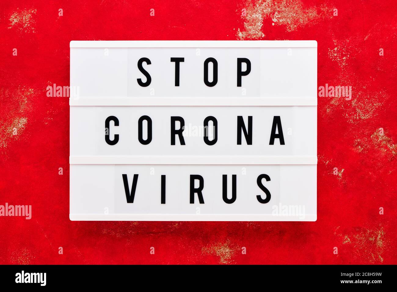 STOP CORONA VIRUS written in light box on red background. Health care ...