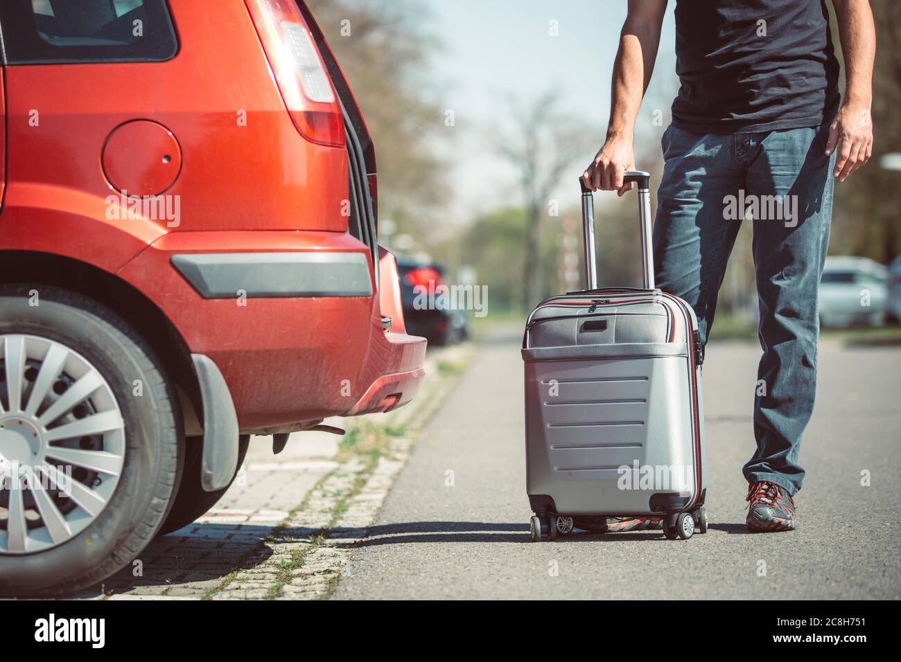 Girl loading luggage into car hi-res stock photography and images - Alamy
