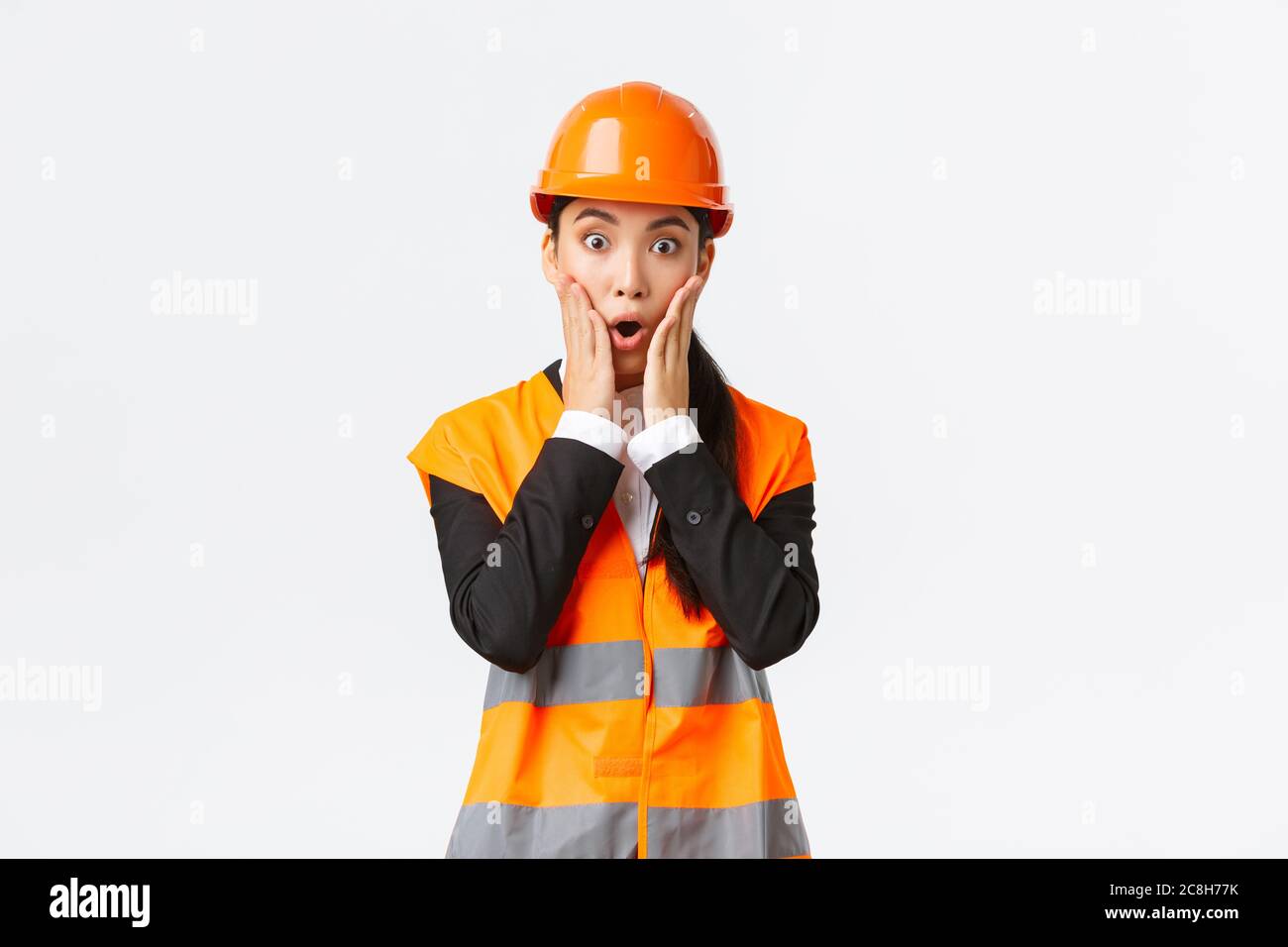 Shocked and concerned asian female engineer having problem at building ...