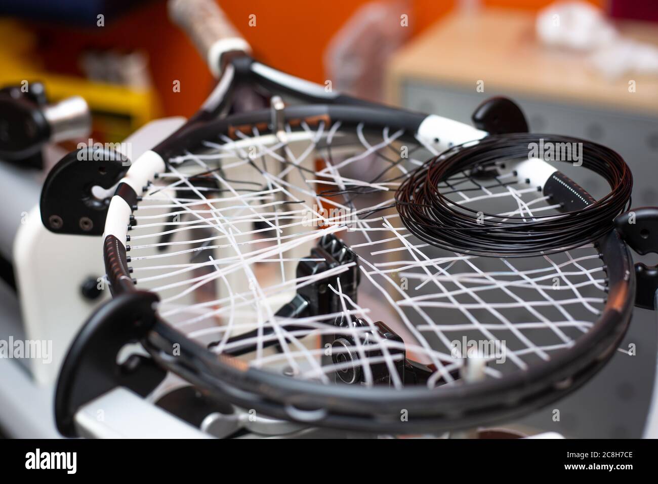 Process of stringing a tennis racket in a tennis shop, sport and ...