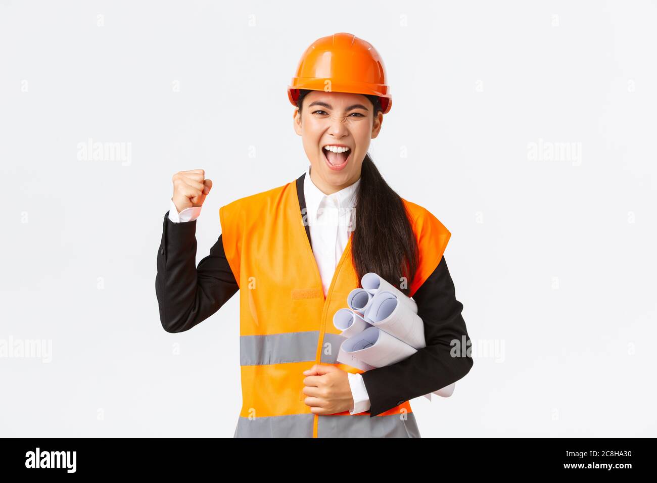 Successful female asian engineer, architect in safety helmet and ...