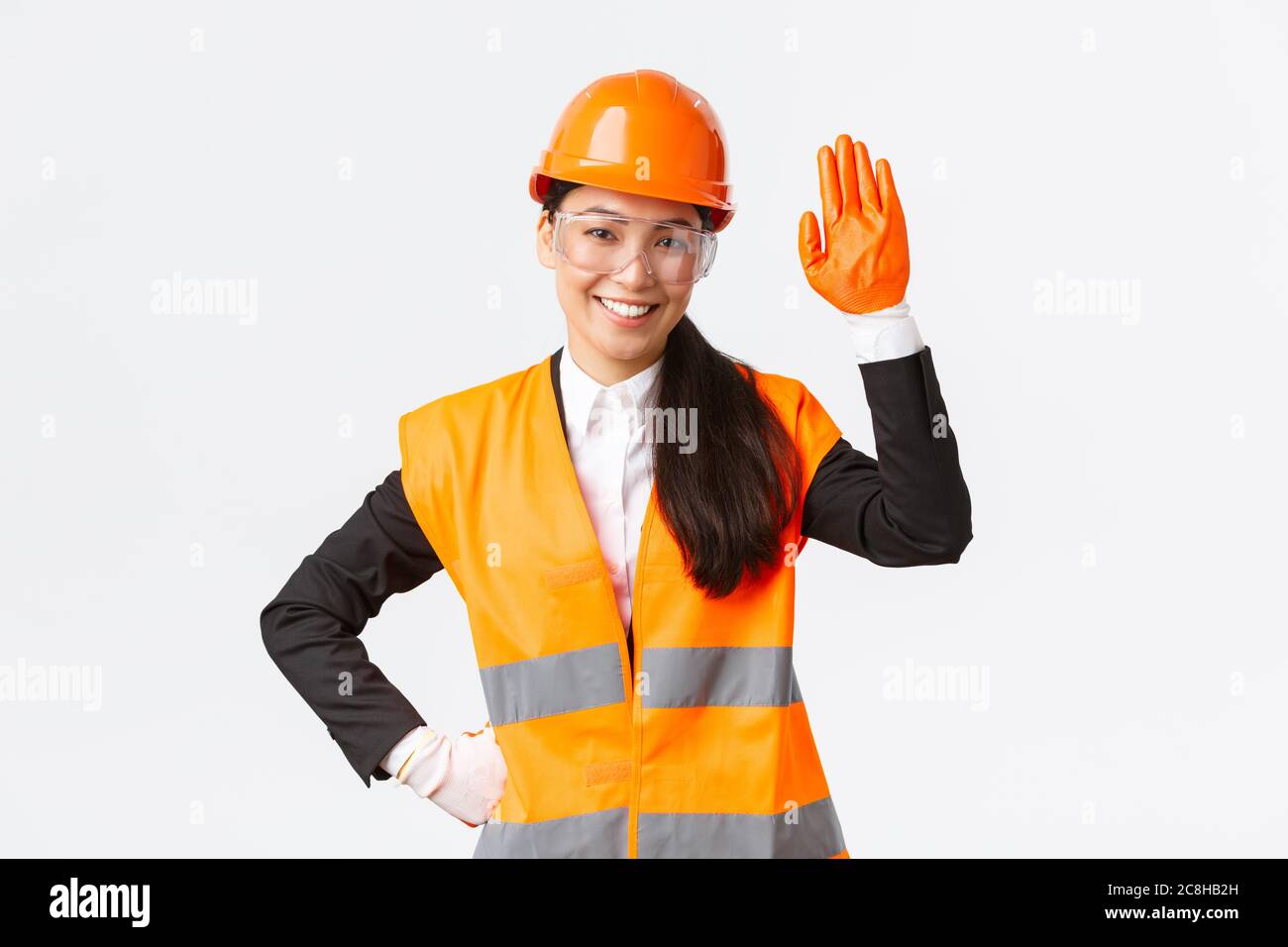 Friendly smiling asian female construction engineer, architect in ...