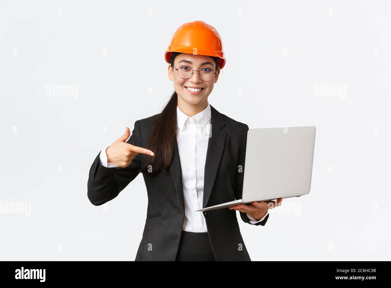 Smiling pleased asian female chief engineer showing chart with ...