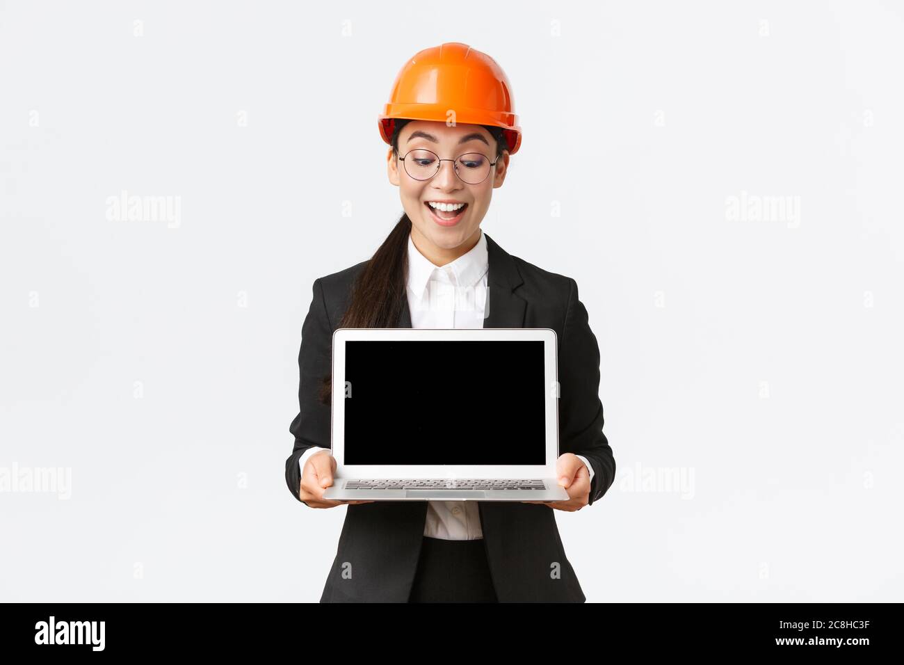 Impressed happy asian female chief engineer showing great results of ...