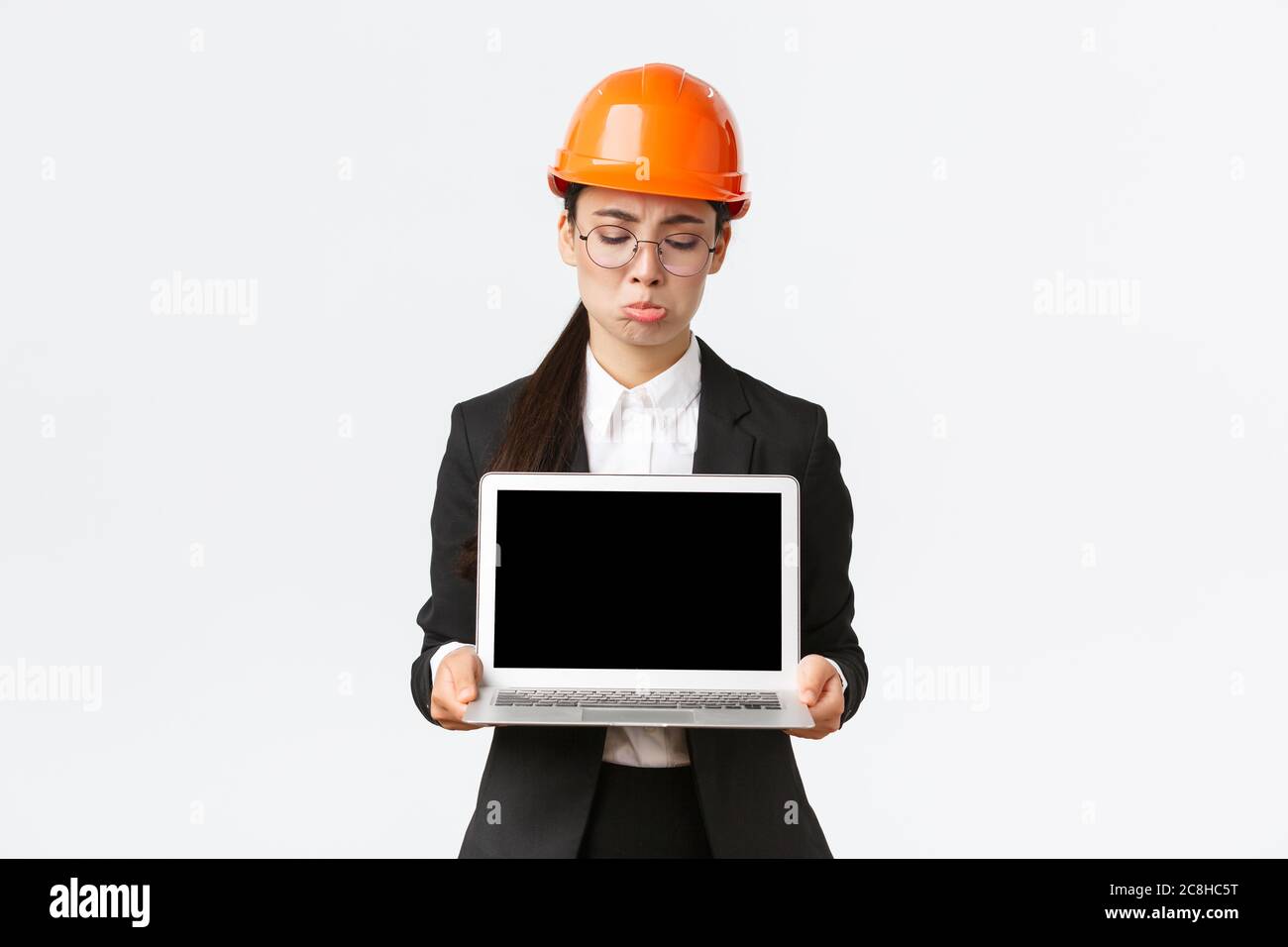 Disappointed gloomy asian female engineer showing bad results, wearing ...