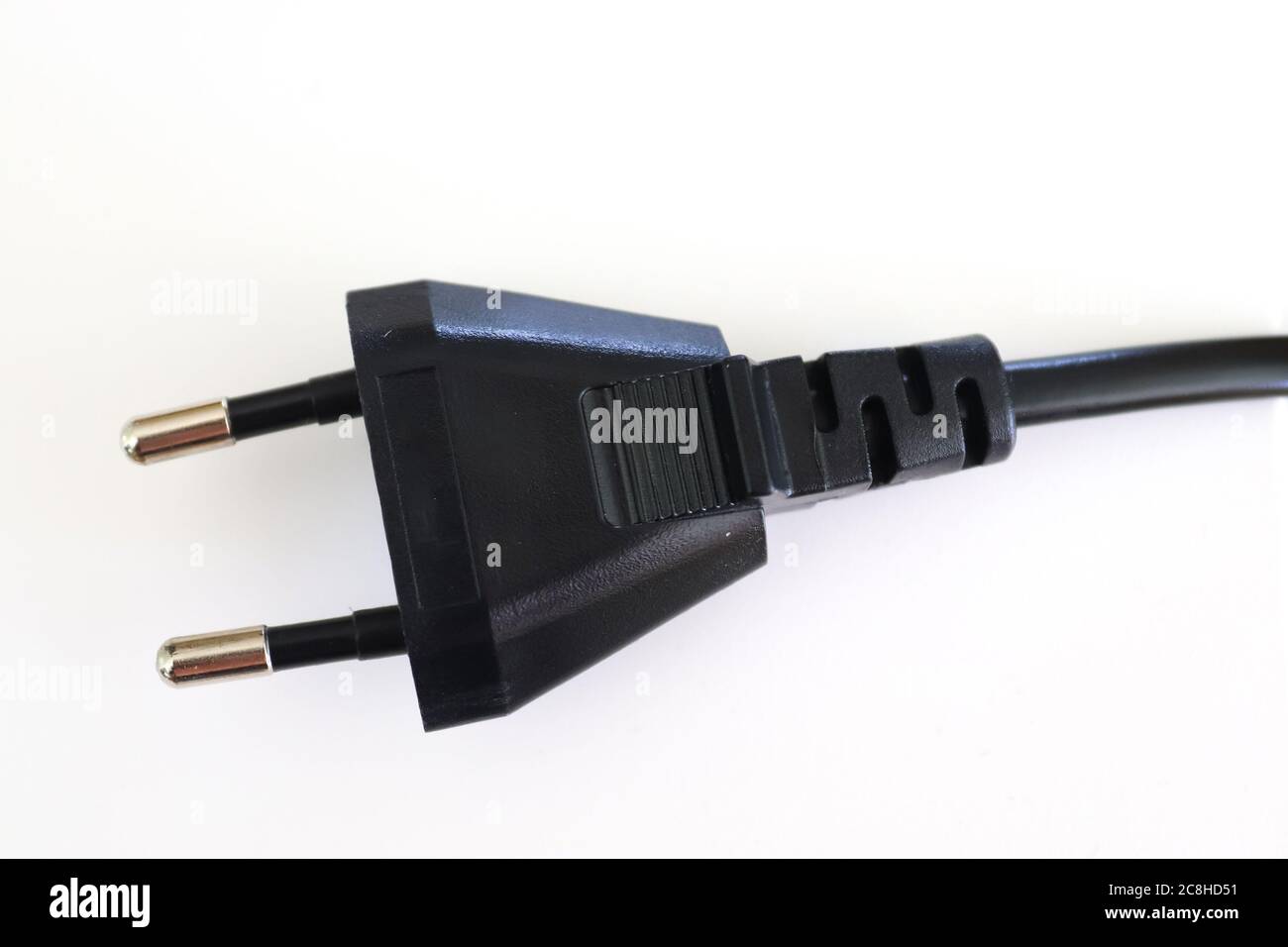 Electrical black and white european plugs isolated on a white ...