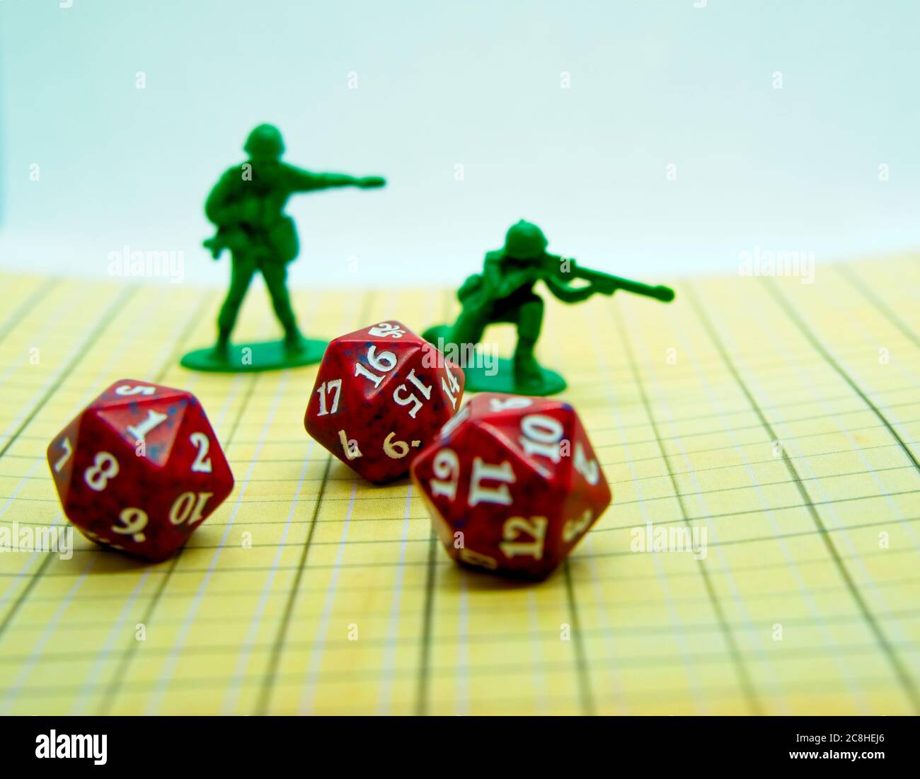 Role-playing board with pentagonal-shaped red dice and plastic figures ...