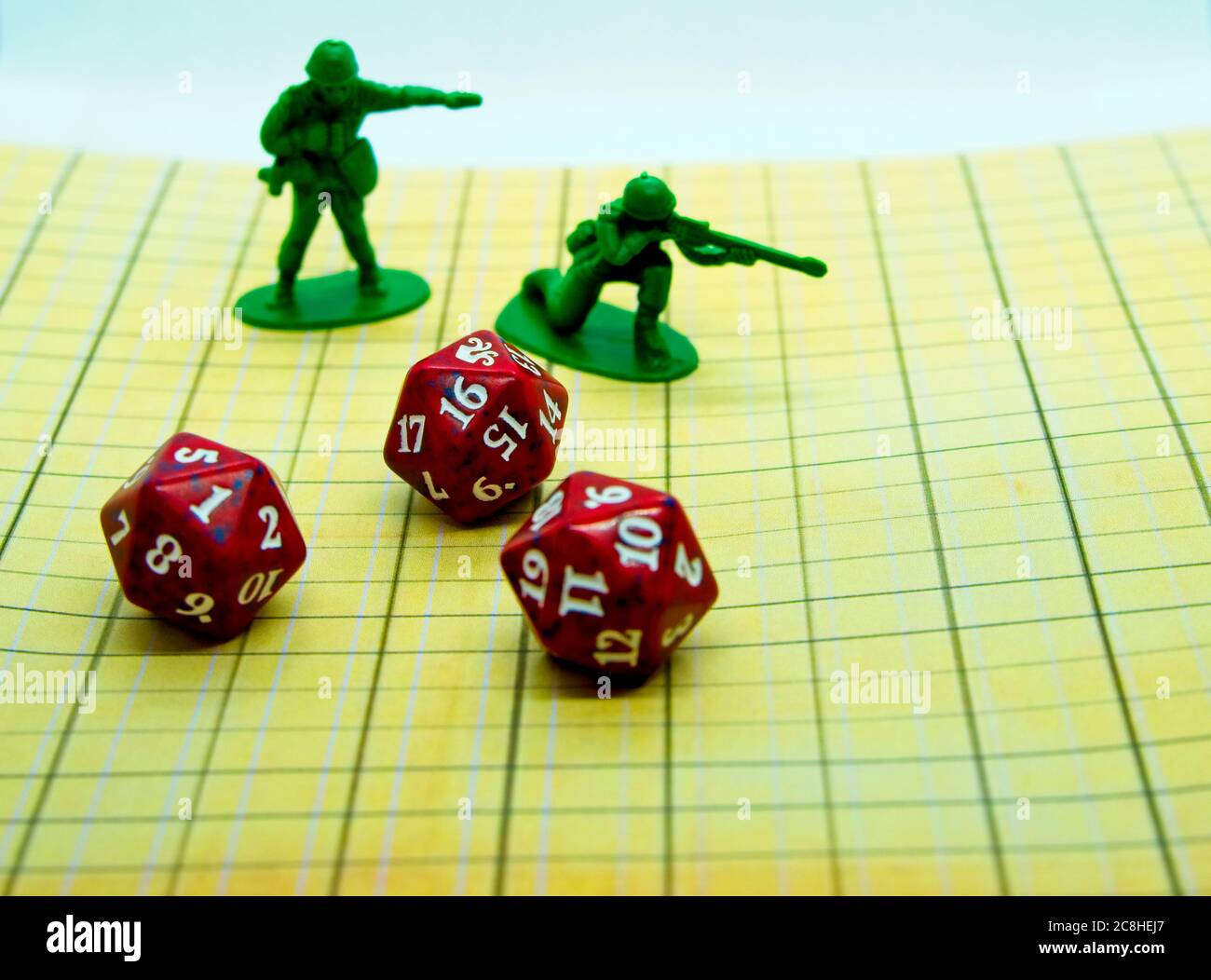 Role-playing field with pentagonal-shaped red dice and plastic ...