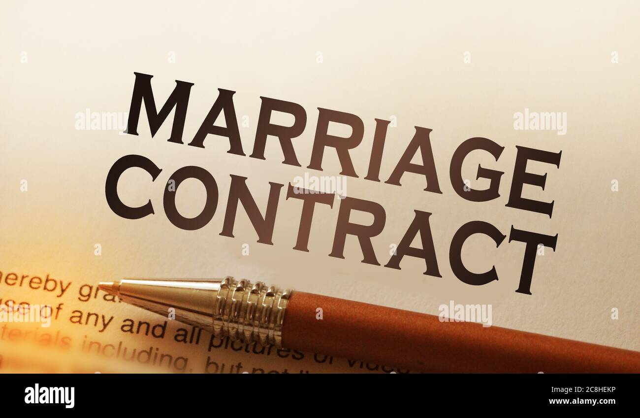 Marriage contract and luxury pen. Pre-marital prenuptial agreement ...