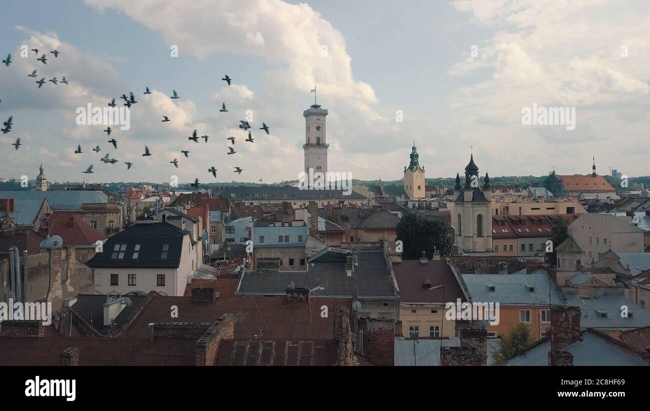 Aerial drone shot of city Lviv, Ukraine. Flight above roofs and streets ...