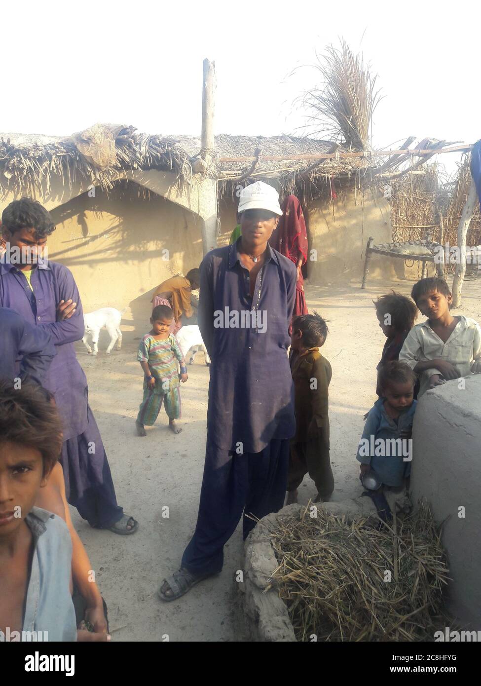 Villagers near their home Stock Photo - Alamy