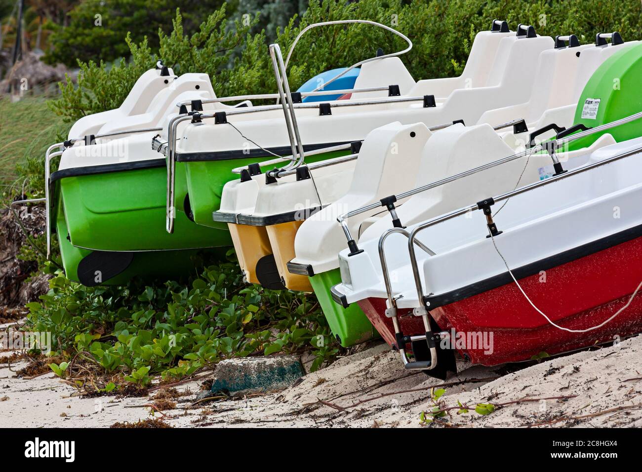 Colourful paddle-boats on a beach Stock Photo - Alamy