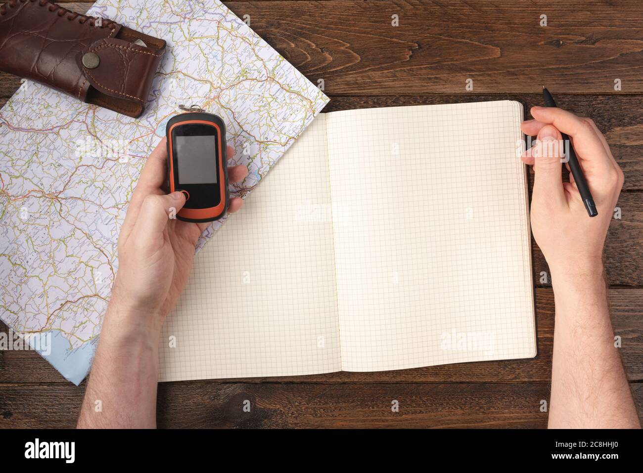 Travel planning concept. Hand writing in blank notepad with gps ...