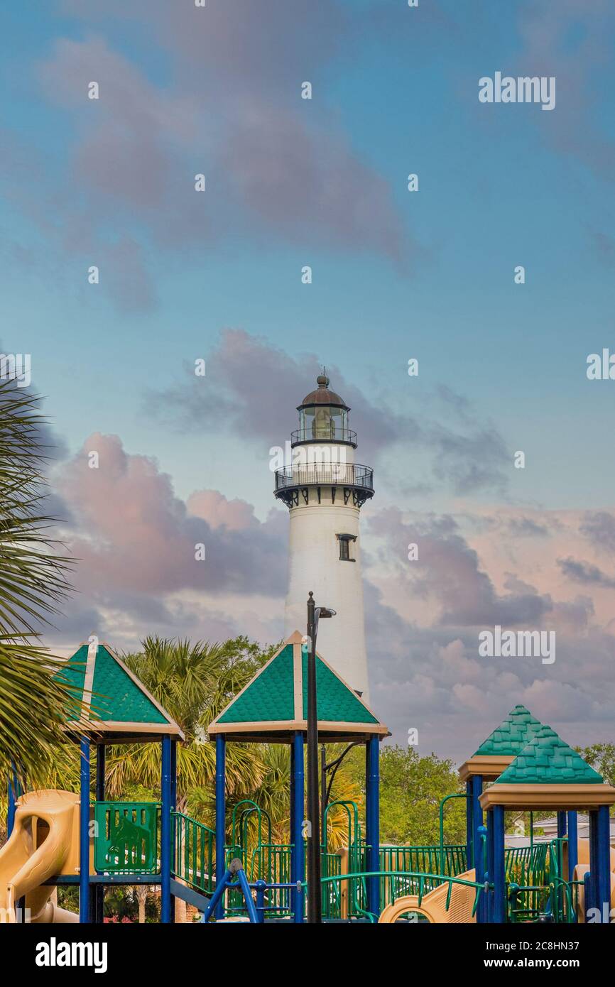 Lighthouse Beyond Green Playground Stock Photo - Alamy