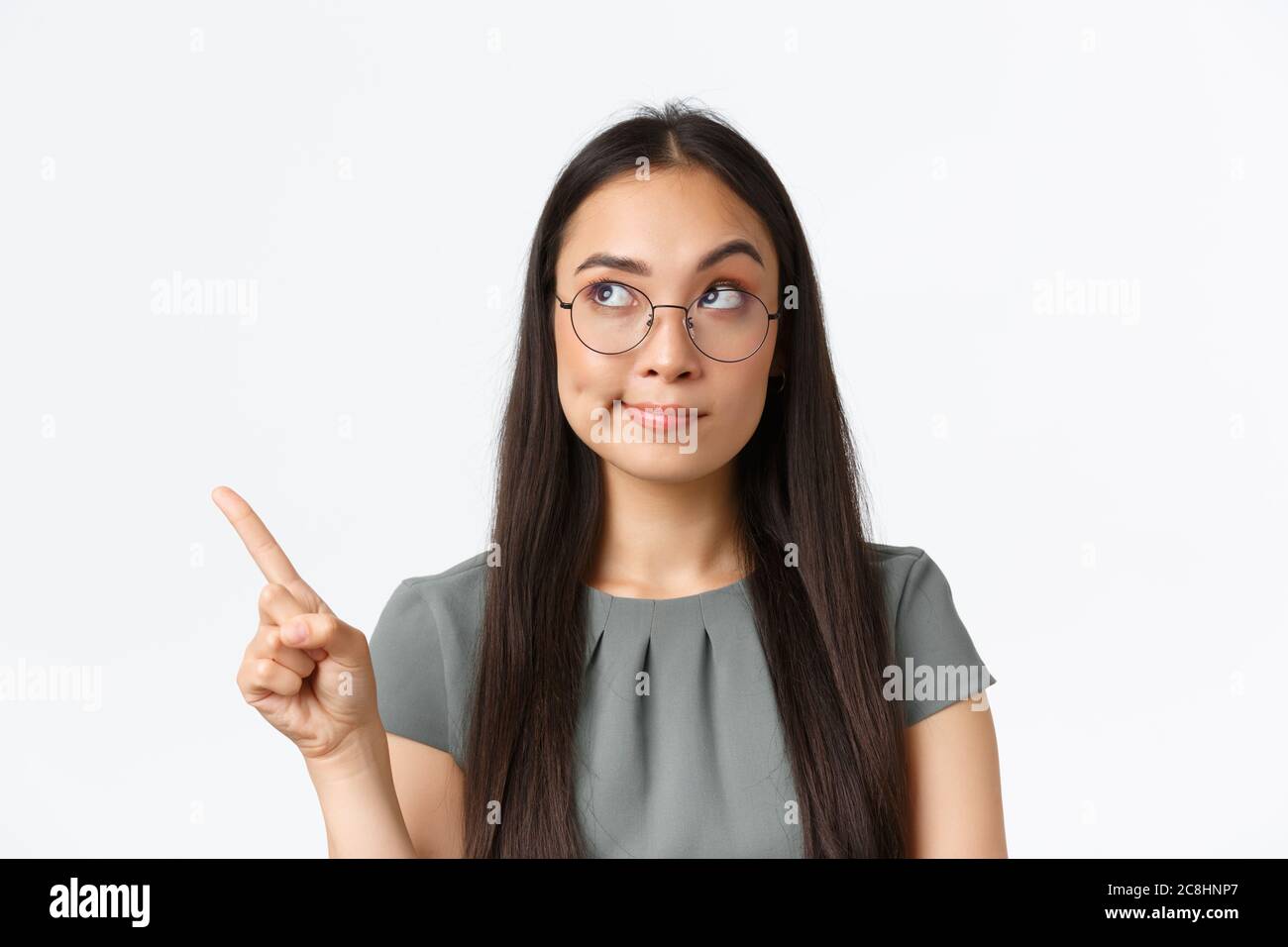 Skeptical and doubtful asian female in glasses, smirk as looking and ...