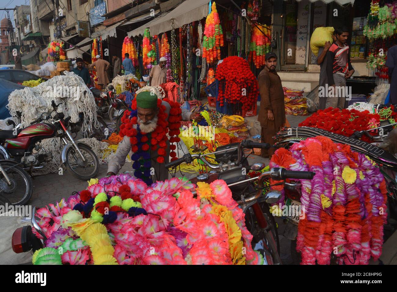 Lahore, Pakistan. 24th July, 2020. Pakistani shopkeeper display ...