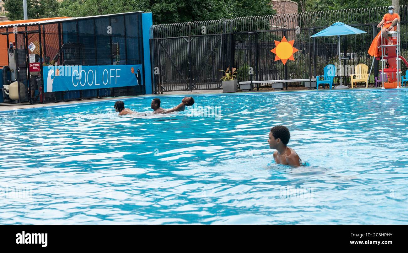 New York, NY - July 24, 2020: People seen enjoying swimming and play on ...