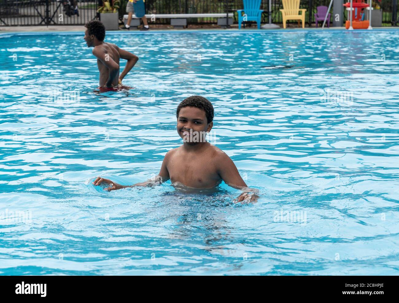 New York, NY - July 24, 2020: People seen enjoying swimming and play on ...