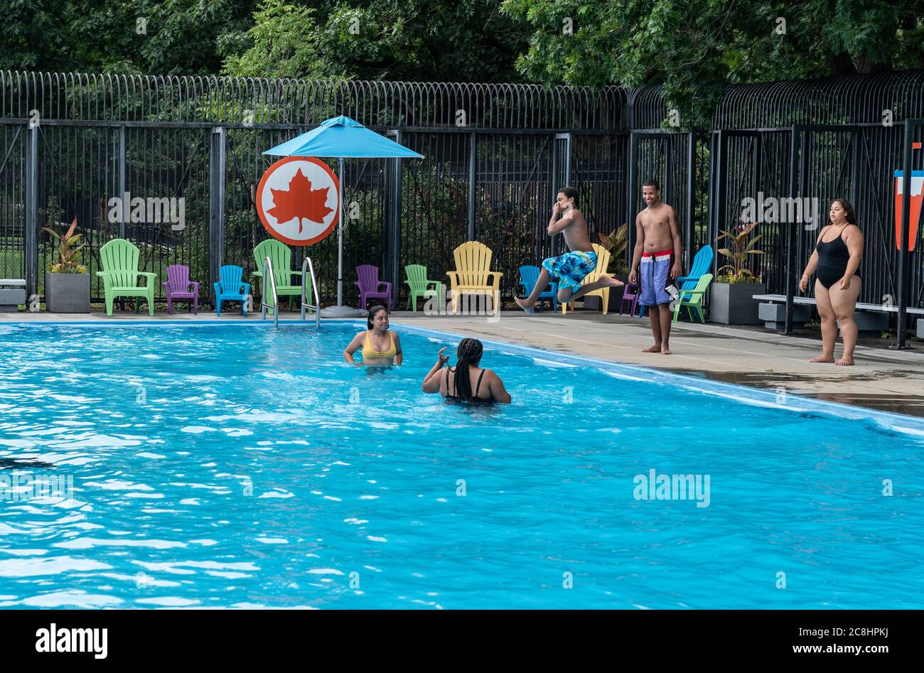 New York, NY - July 24, 2020: People seen enjoying swimming and play on ...