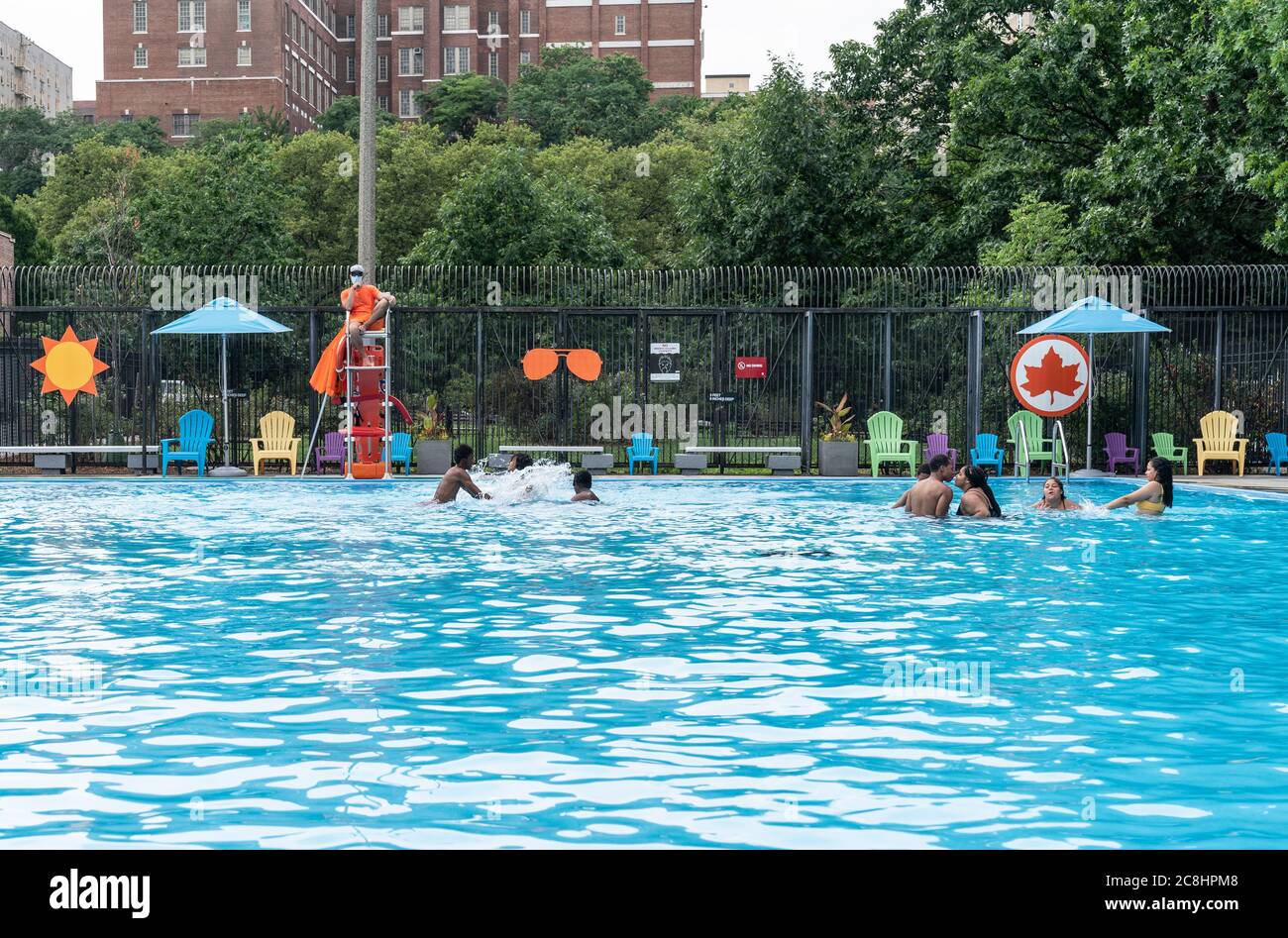 New York, NY - July 24, 2020: People seen enjoying swimming and play on ...