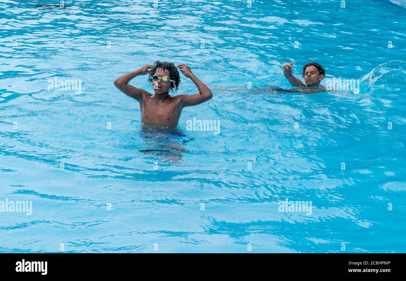 New York, NY - July 24, 2020: People seen enjoying swimming and play on ...