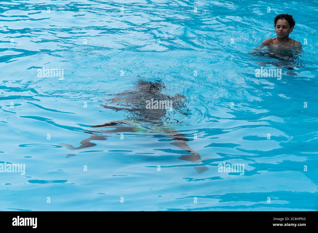 New York, NY - July 24, 2020: People seen enjoying swimming and play on ...
