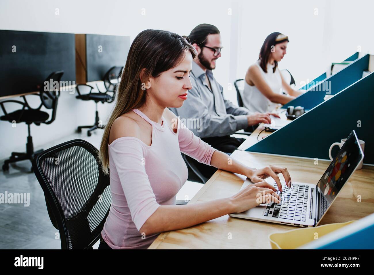 young latin woman working at office or creative teamwork, Mexican ...