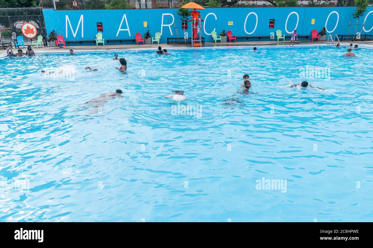 New York, NY - July 24, 2020: People seen enjoying swimming and play on ...