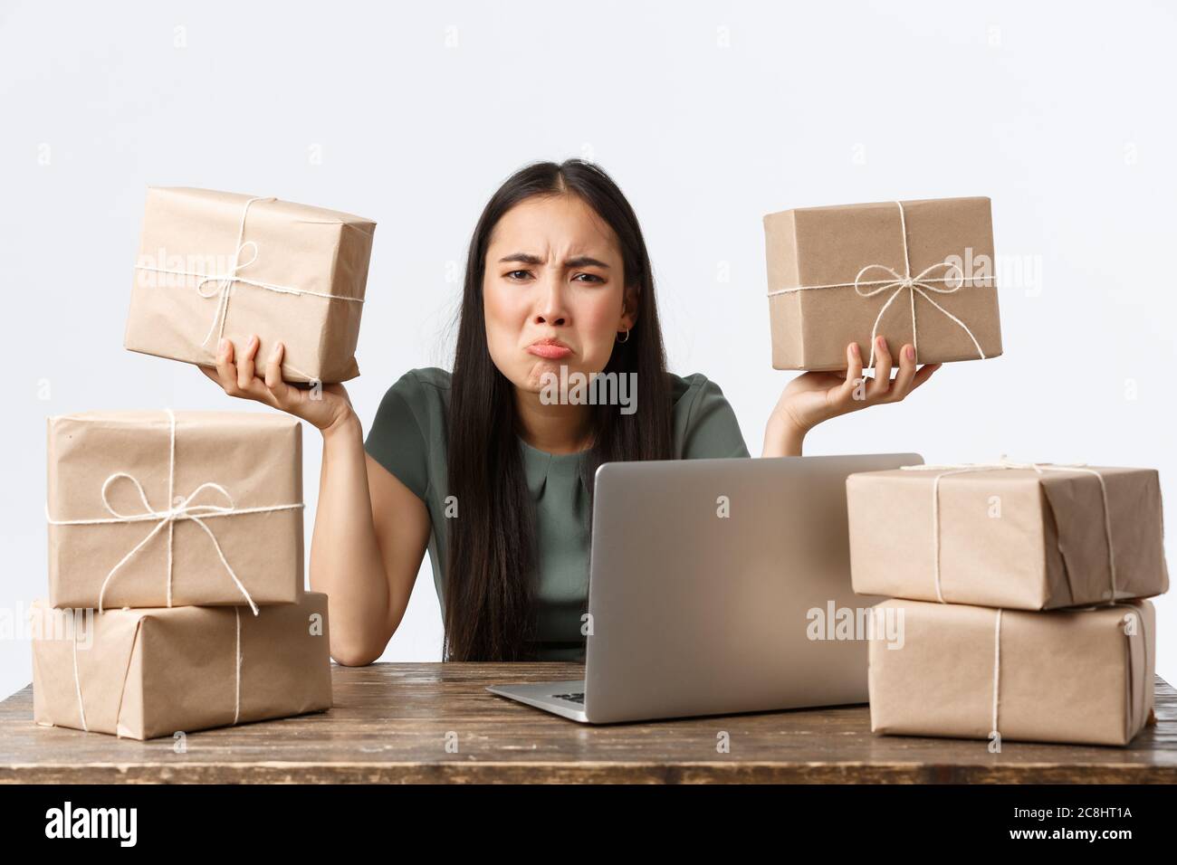 Small business owners, startup and e-commerce concept. Pouting tired ...