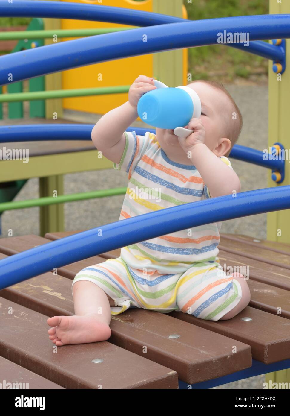 childhood boy drinks water from a mug Stock Photo - Alamy