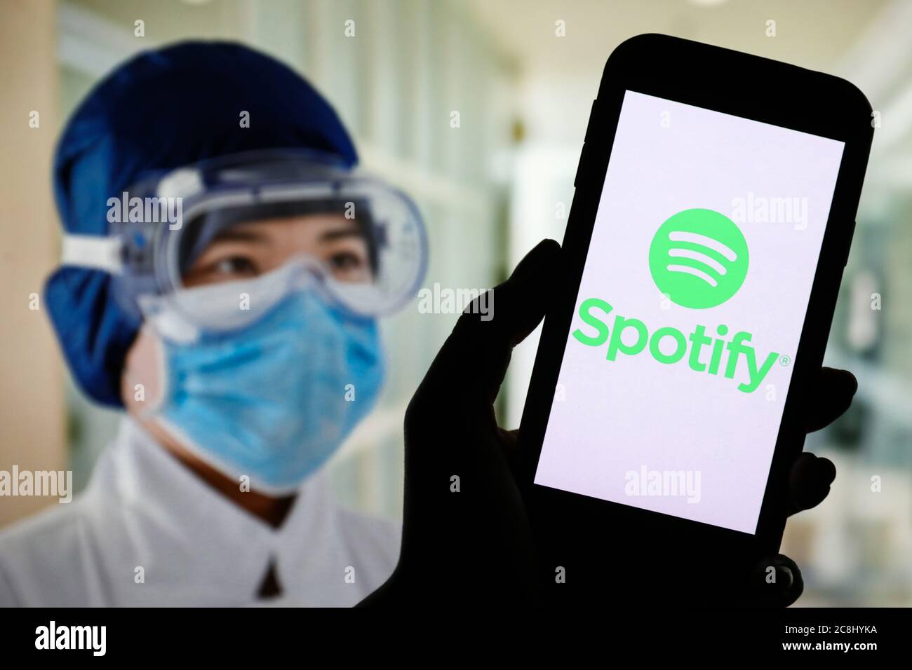 In this photo illustration a Spotify music app logo seen displayed on a ...