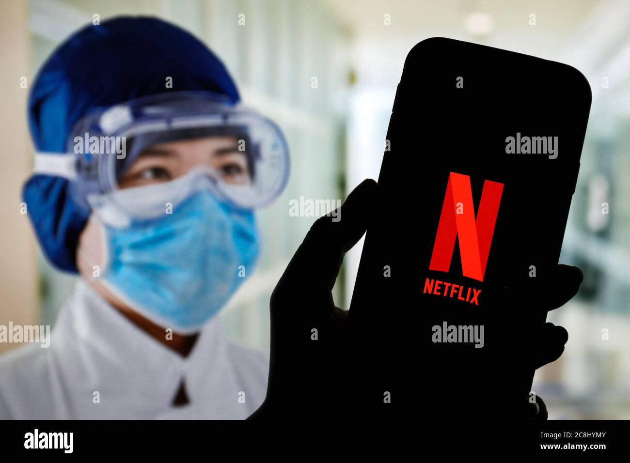 In this photo illustration a Netflix logo seen displayed on a ...